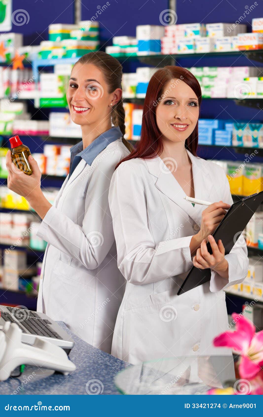 Pharmacist with Assistant in Pharmacy Stock Photo - Image of shelf ...