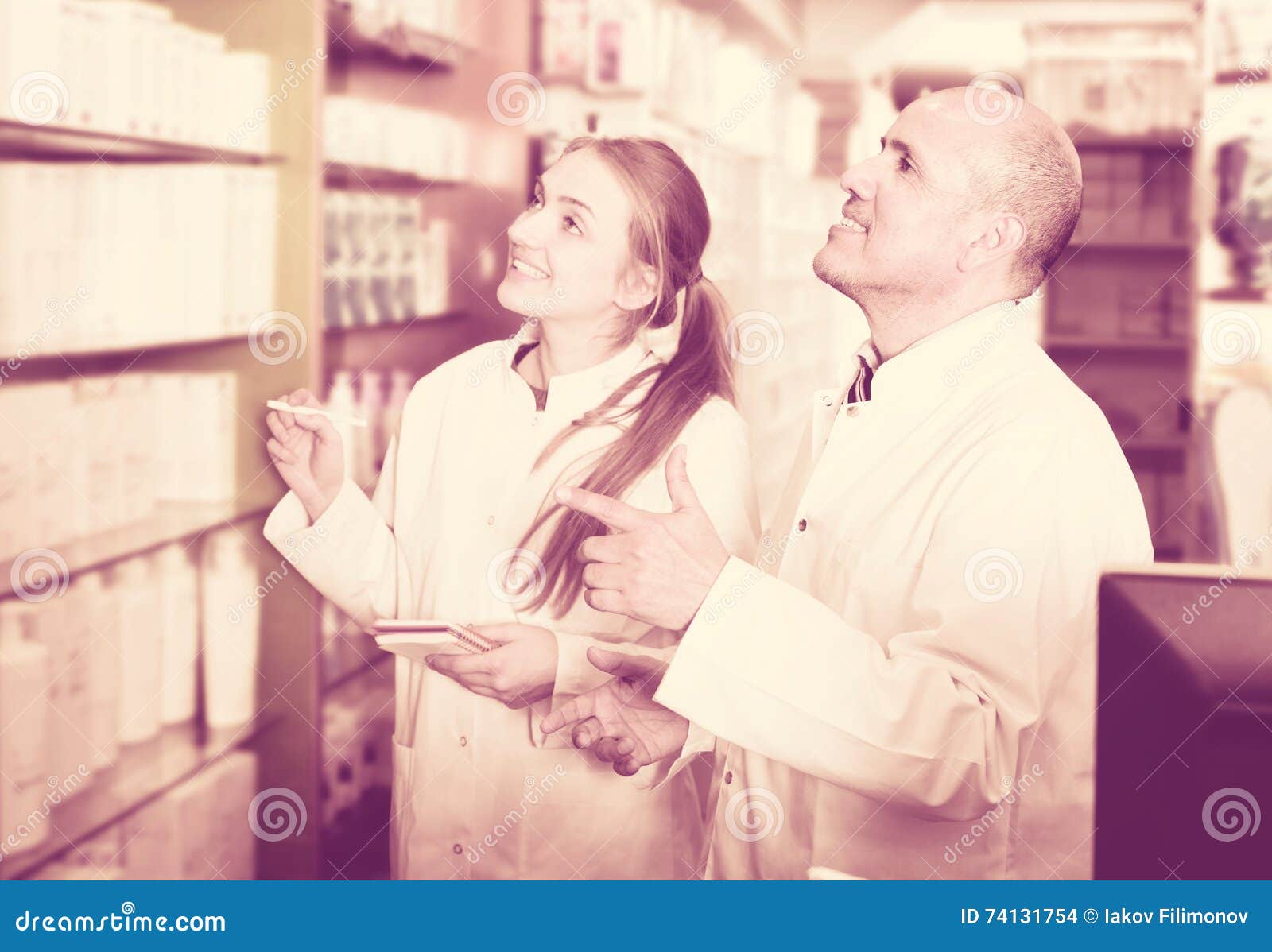 Pharmacist and Assistant Working at Farmacy Reception Stock Photo ...
