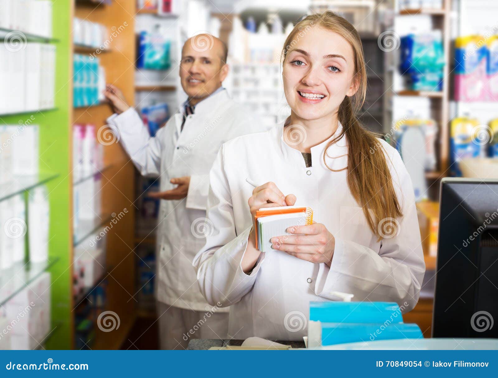 Pharmacist and Assistant Working at Farmacy Reception Stock Photo ...