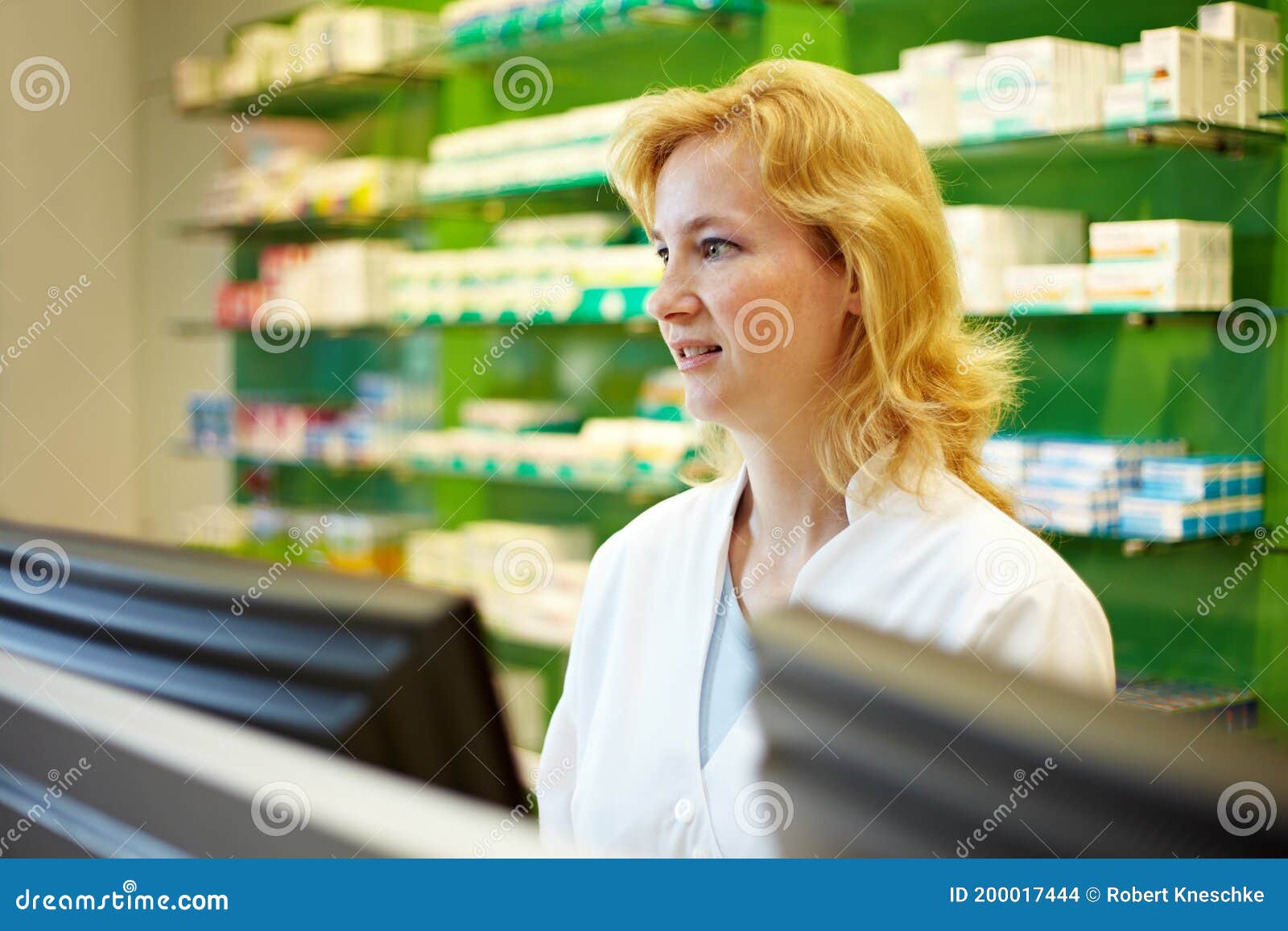Pharmacist Behind the Counter Stock Photo - Image of counter, computer ...