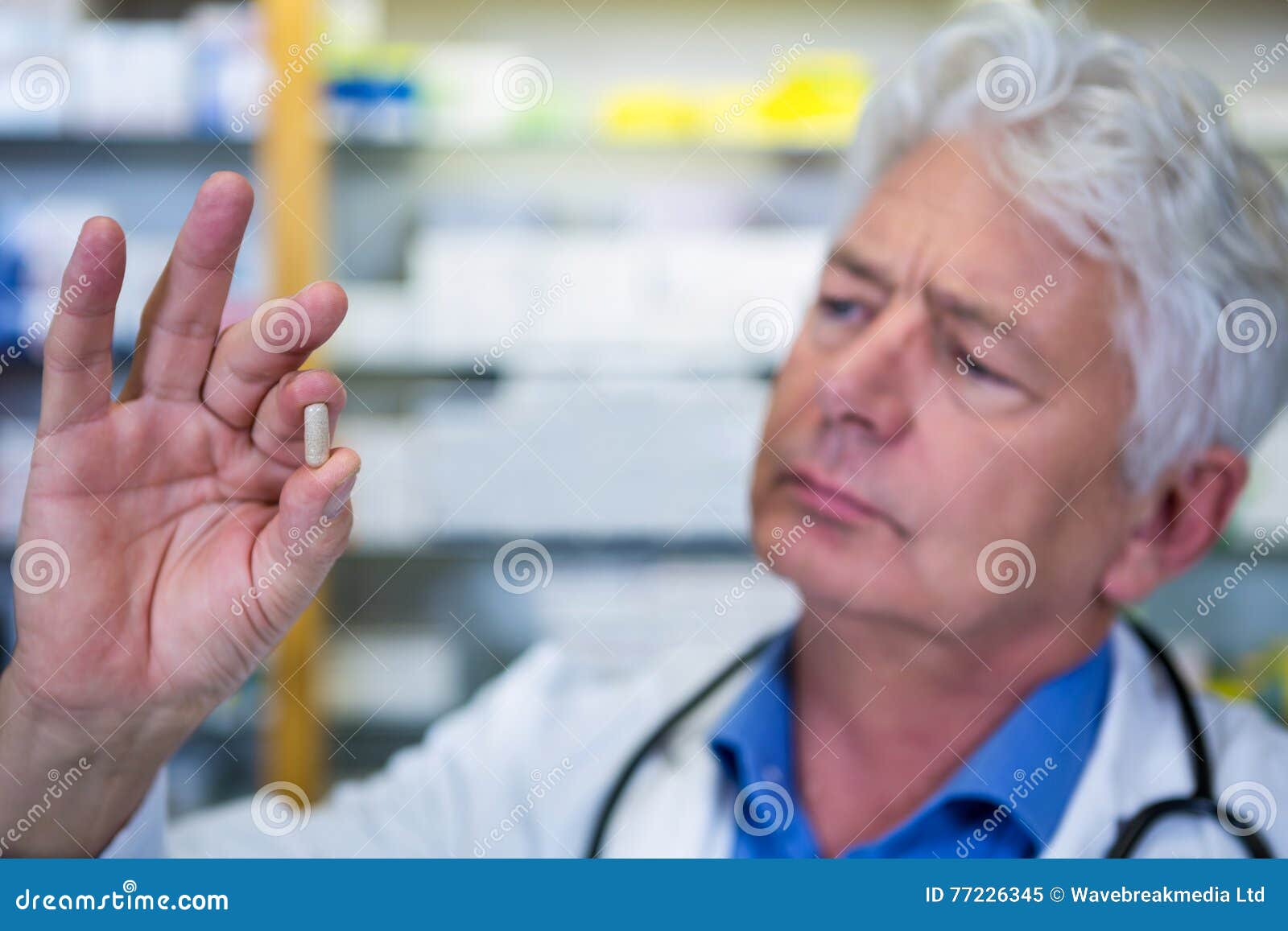 Pharmacist Checking a Capsule Stock Image - Image of caucasian ...