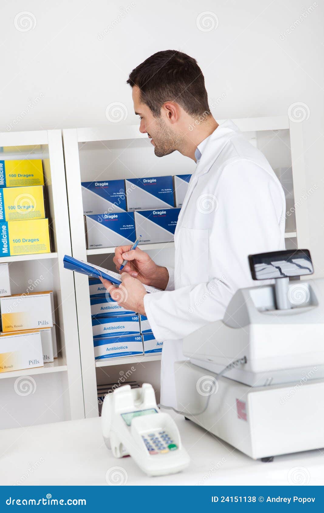 Pharmacist checking drugs stock photo. Image of drugstore - 24151138