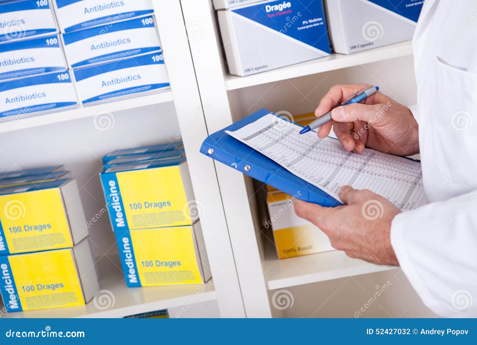 Pharmacist checking drugs stock photo. Image of happy - 52427032