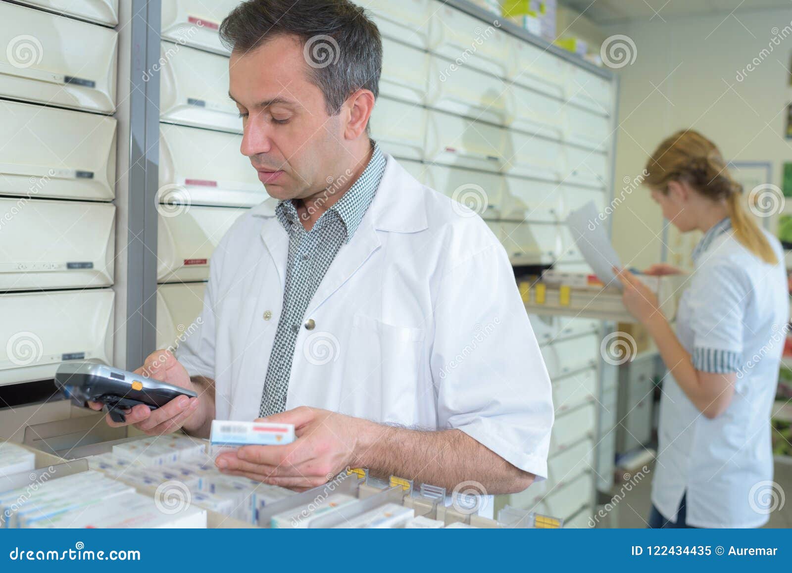 Pharmacist Checking Medication on Electronic Device Stock Image - Image ...