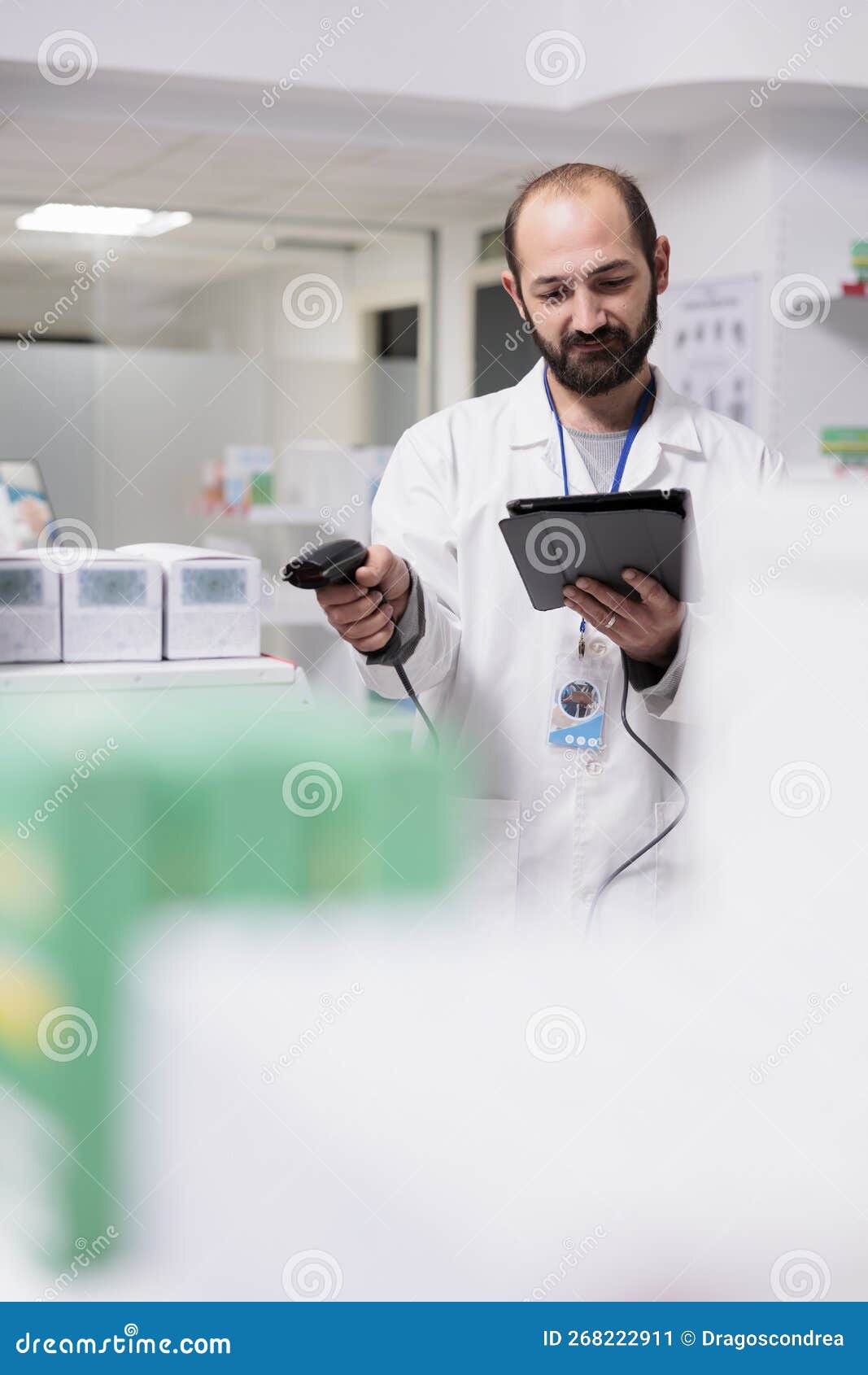 Pharmacist Checking Medication List on Tablet Computer while Scanning ...