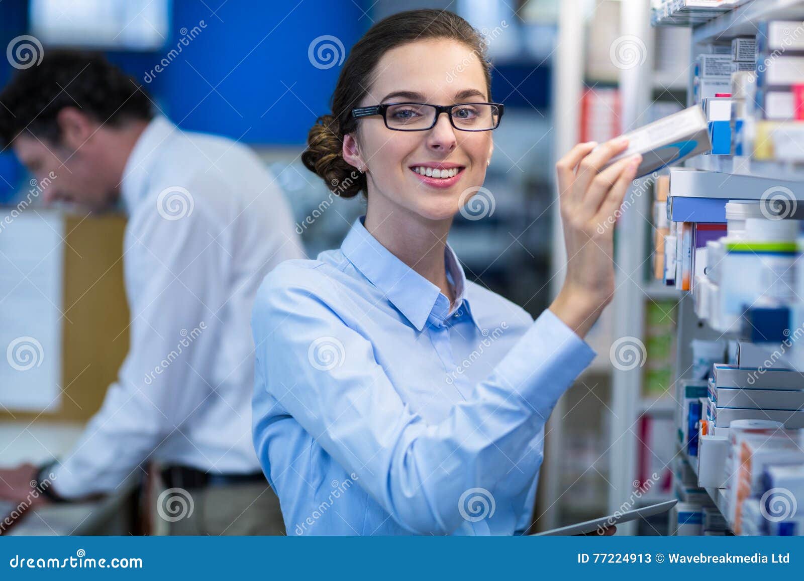 Pharmacist Checking a Medicine in Pharmacy Stock Image - Image of ...
