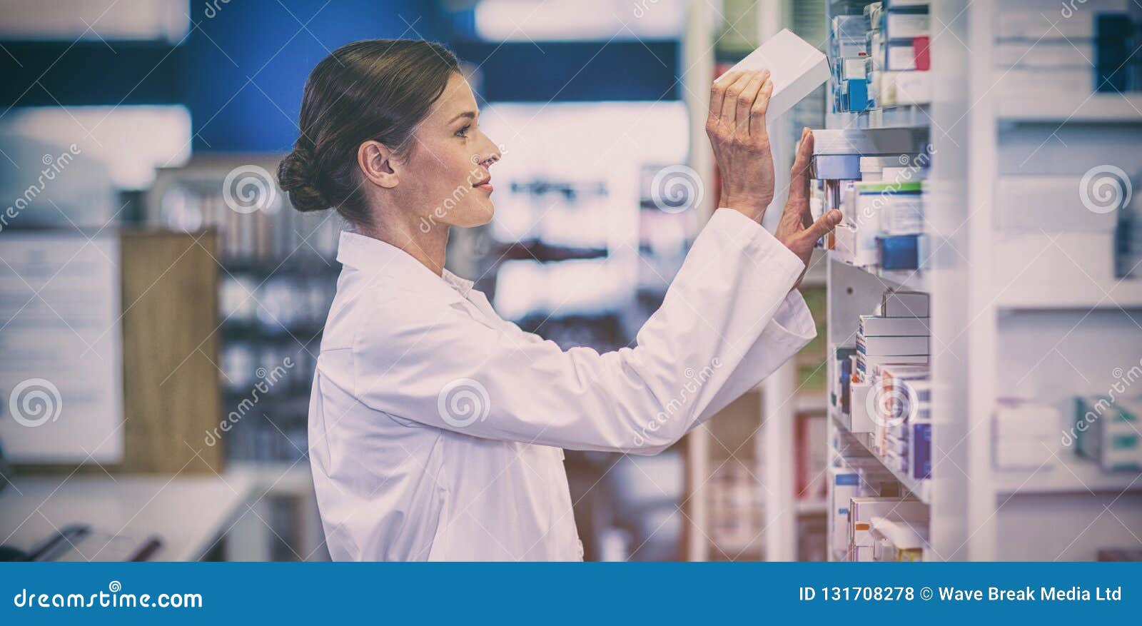 Pharmacist Checking Medicine in Shelf Stock Photo - Image of checking ...