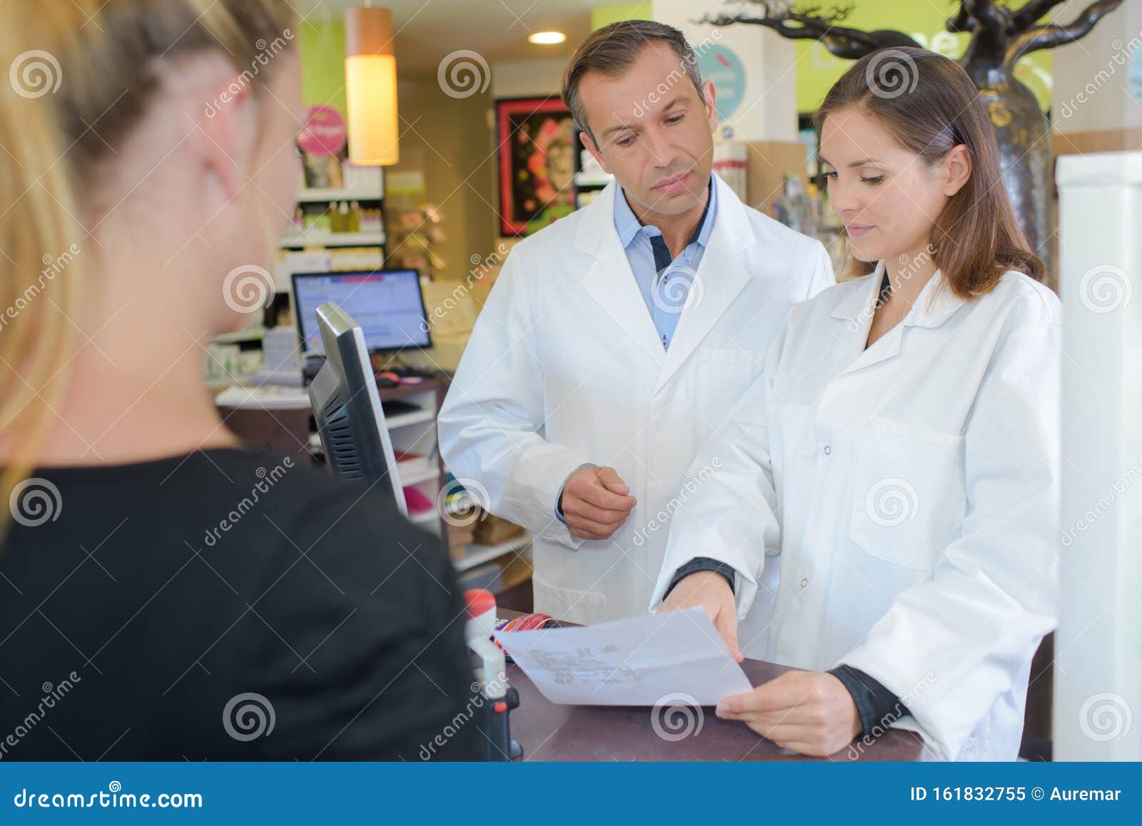 Pharmacist Checking Prescription Stock Image - Image of team, pharmacy ...
