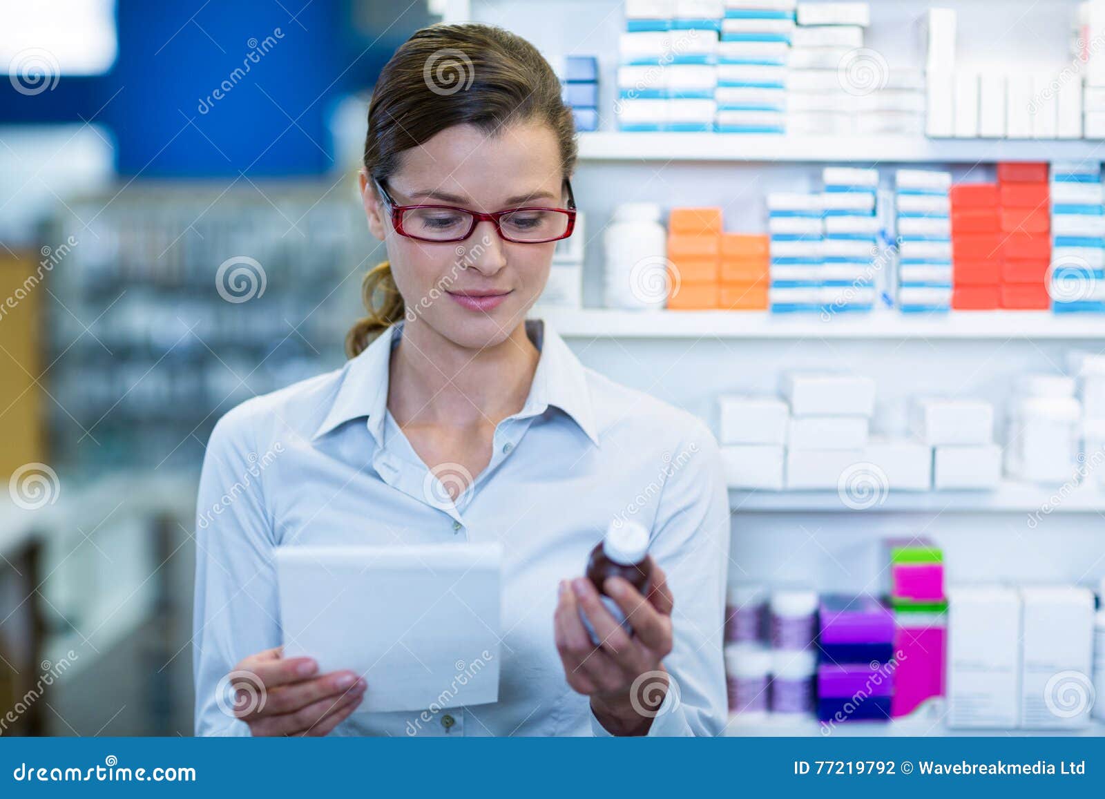 Pharmacist Checking at Prescription and Medicine Container Stock Photo ...