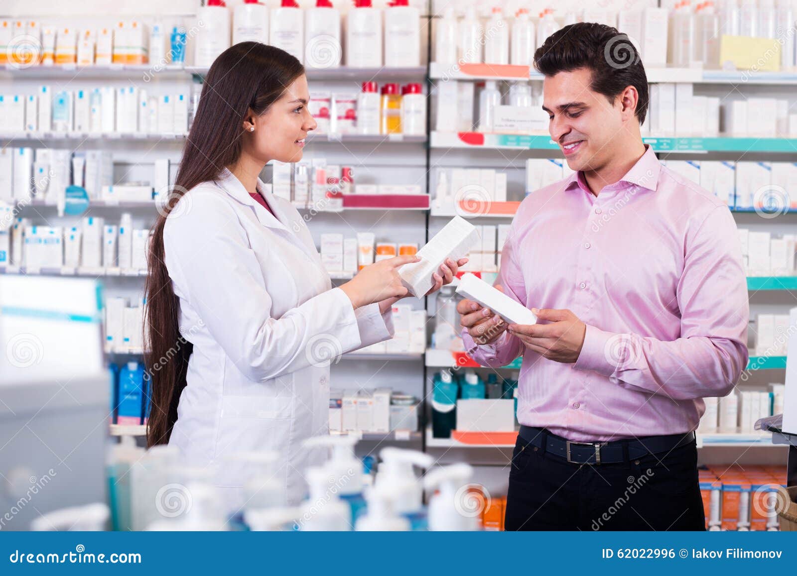 Pharmacist and Consulting Man in Pharmacy Stock Photo - Image of ...