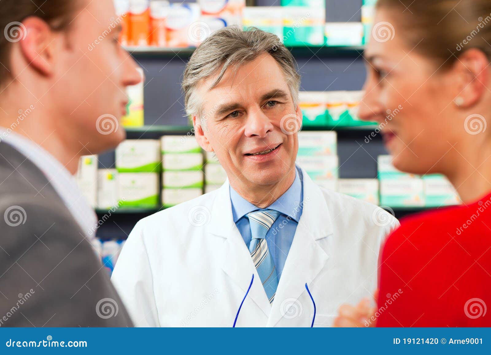 Pharmacist with Customers in Pharmacy Stock Photo - Image of drugs ...