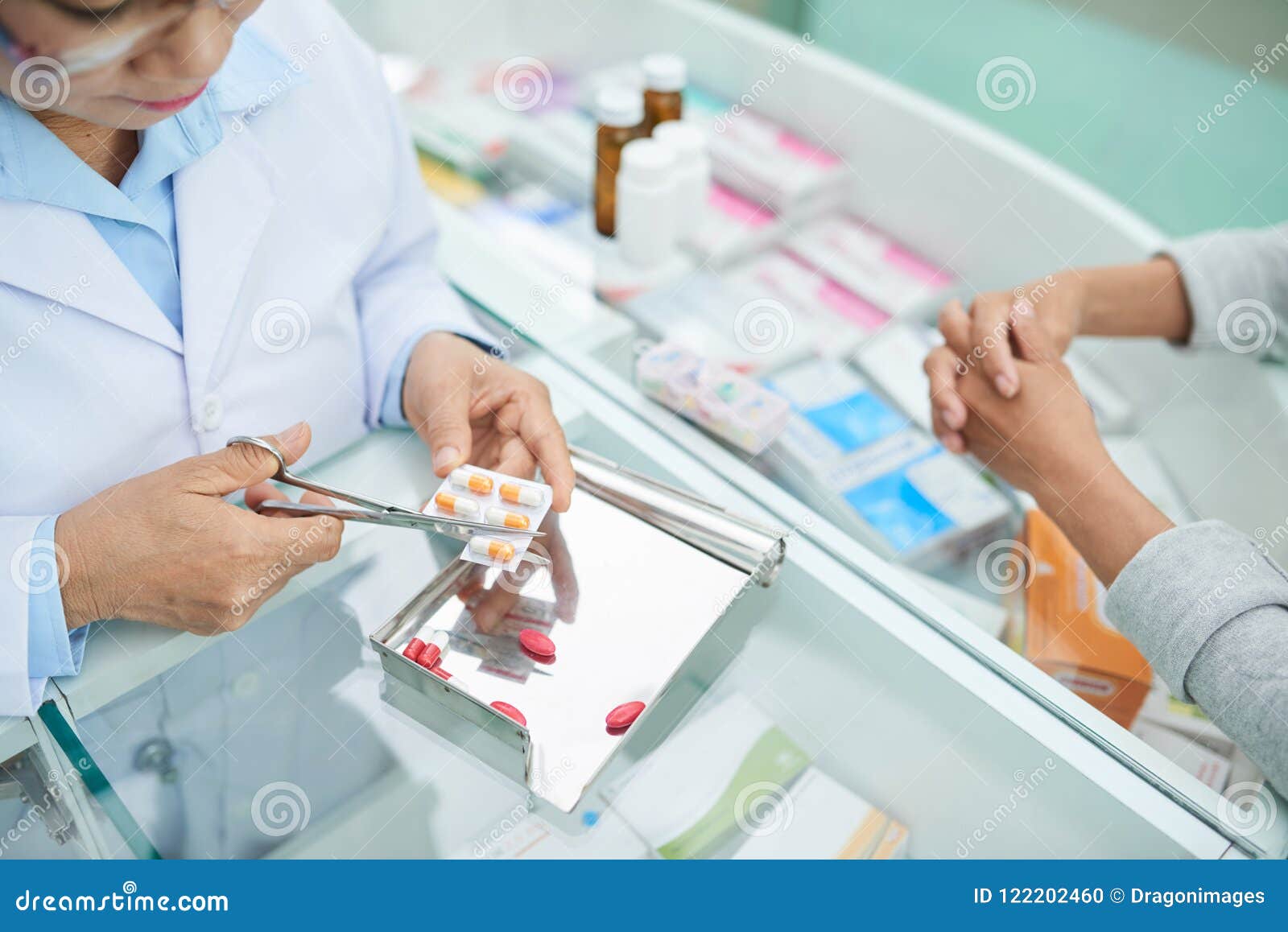 Pharmacist cutting package stock photo. Image of disease - 122202460