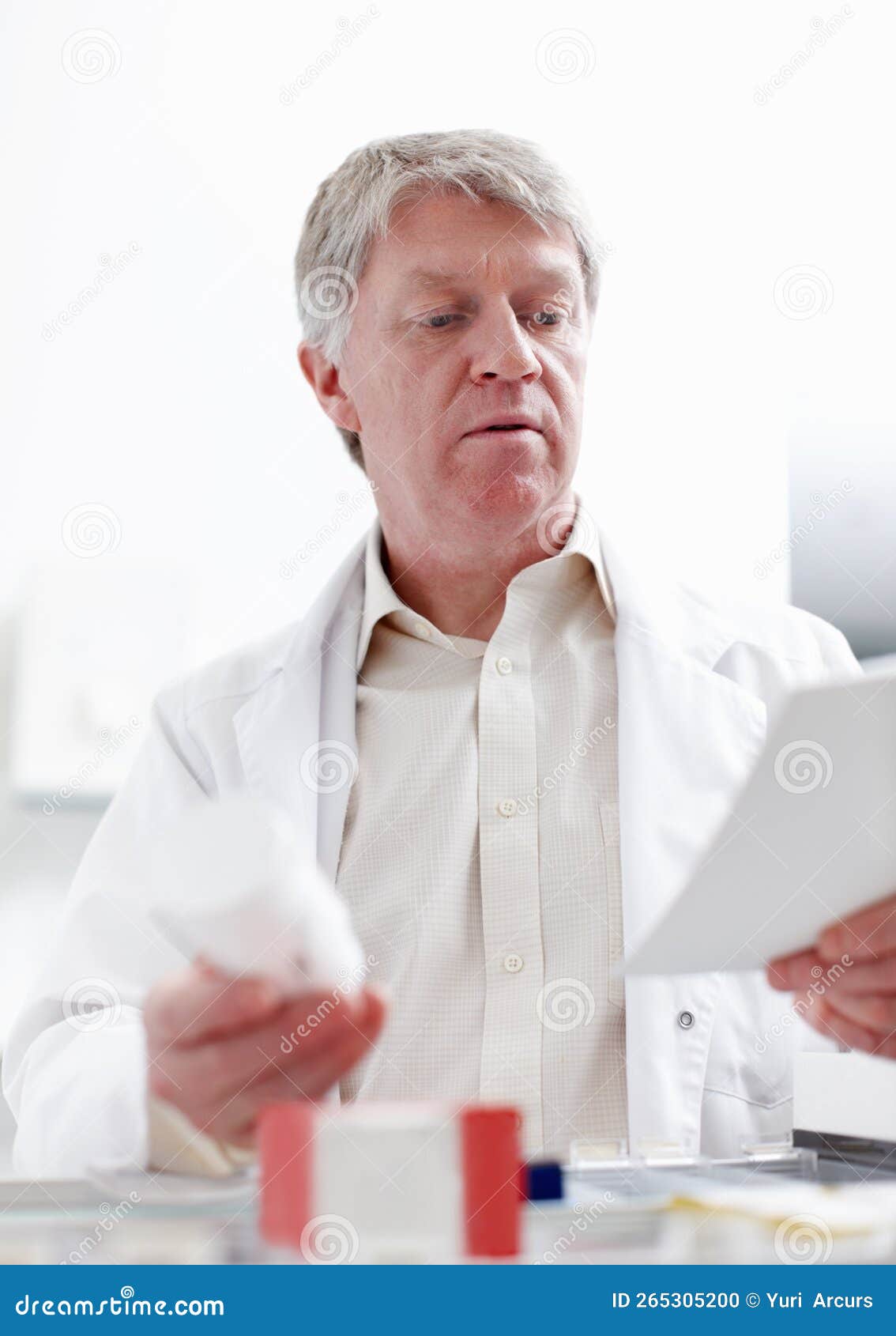 Pharmacist Examining Medicine and Prescription. Portrait of Careful ... Pharmacist Examining Medicine and Prescription. Portrait of Careful ...