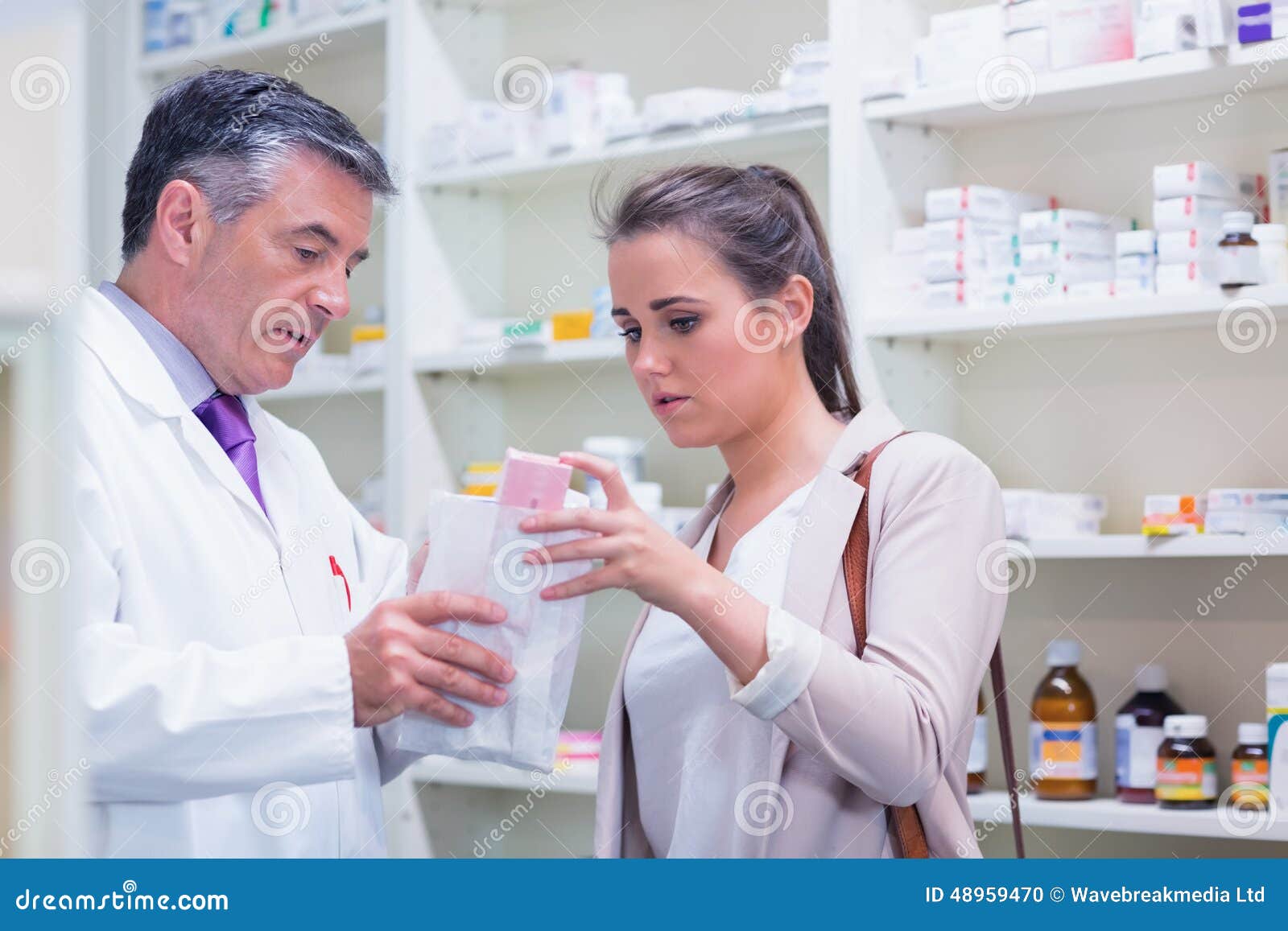 Pharmacist Explaining Medicine To His Customer Stock Photo - Image of ...