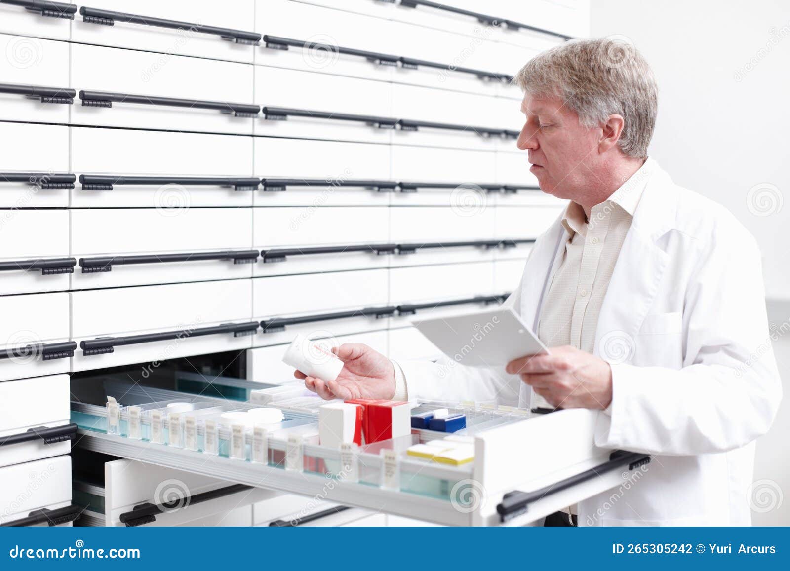 Pharmacist Finding Medicines. Portrait of Pharmacist Busy Finding ...