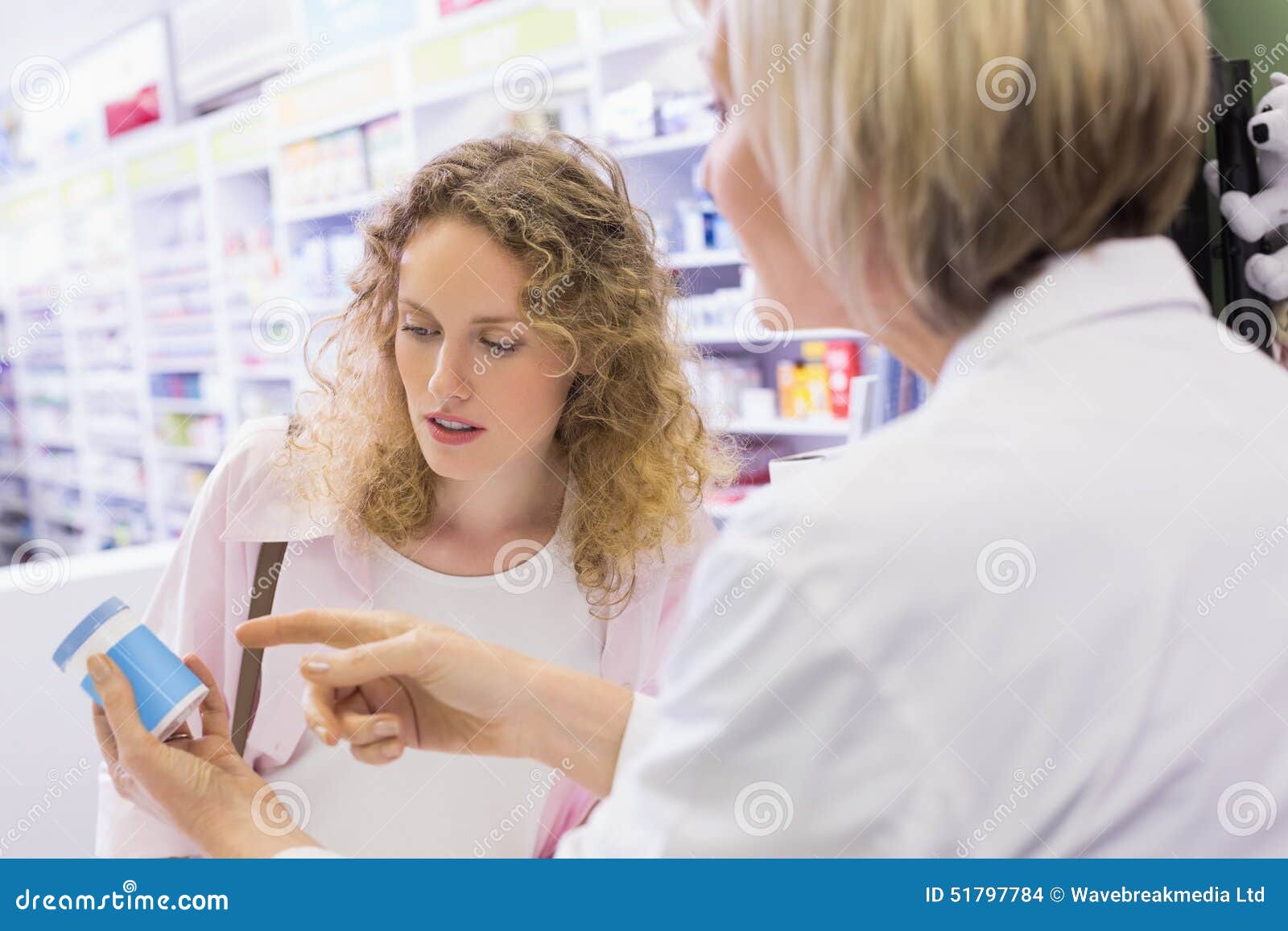 Pharmacist and Her Customer Talking about Medication Stock Photo ...