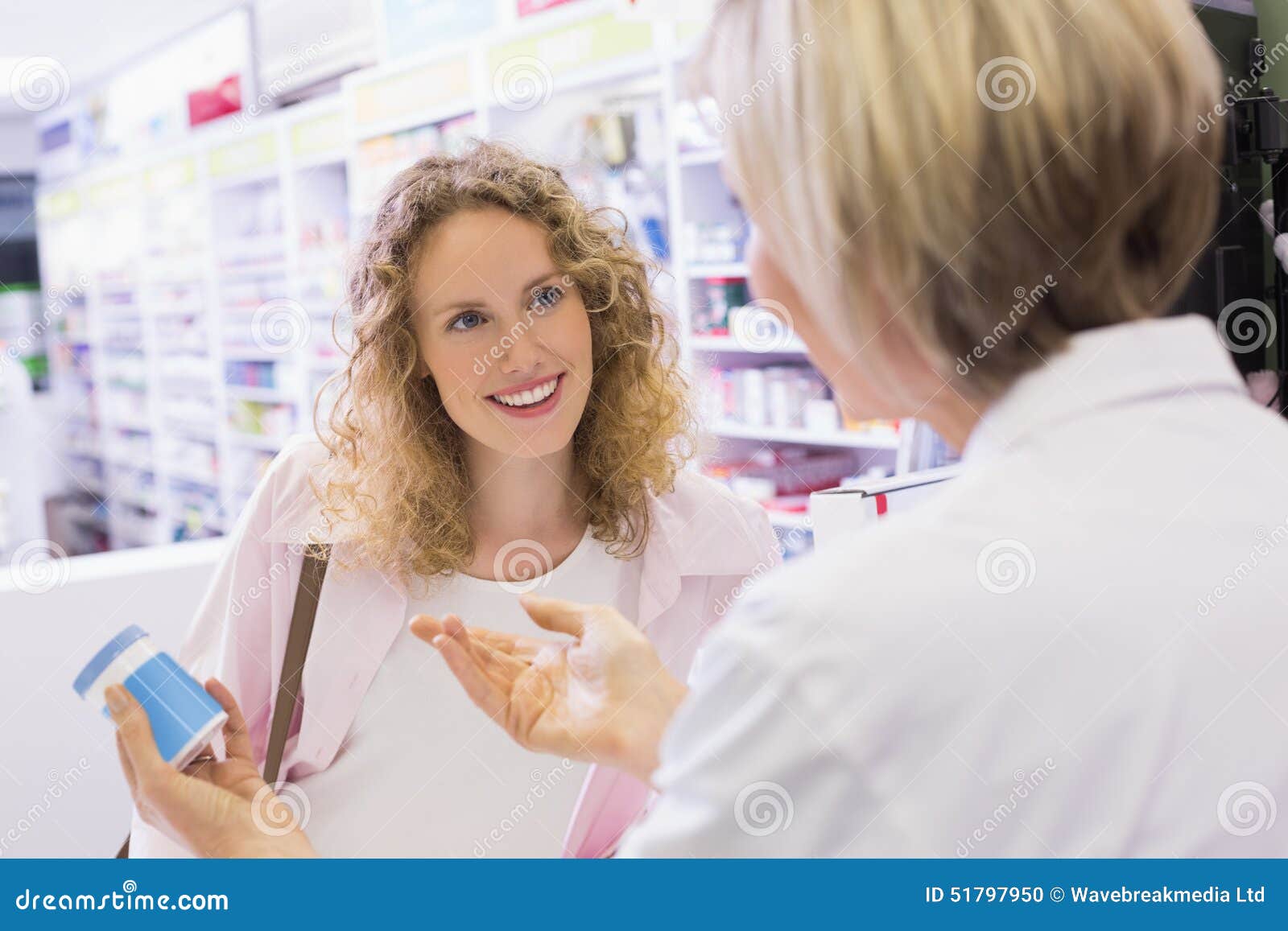 Pharmacist and Her Customer Talking about Medication Stock Photo ...