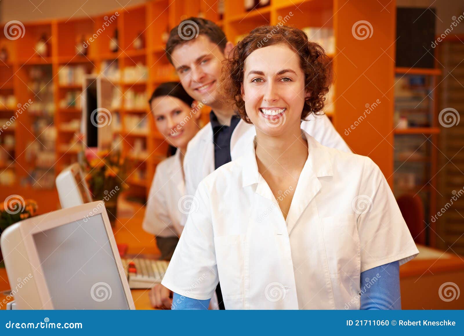 Pharmacist with her team stock photo. Image of coat, laughing - 21711060