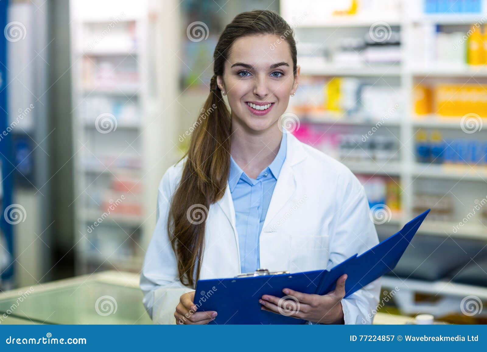 Pharmacist Holding Clipboard Folder in Pharmacy Stock Image - Image of ...
