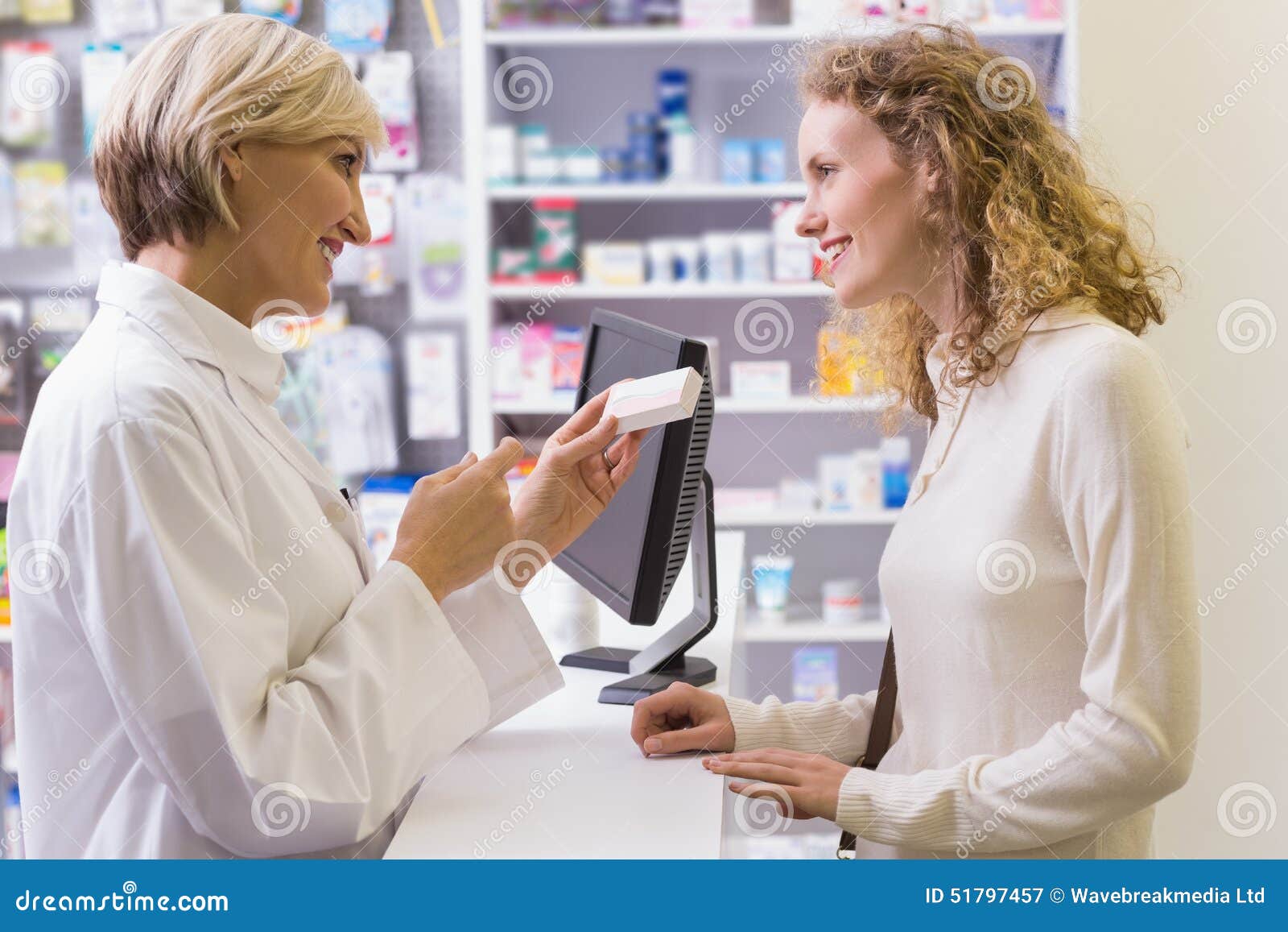 Pharmacist Holding Medicine Box Talking To Customer Stock Photos - Free ...