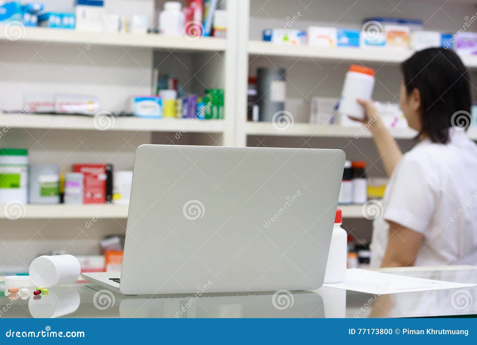Pharmacist with Laptop Computer and Medication Stock Photo - Image of ...