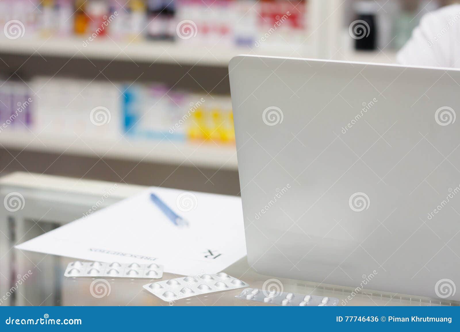 Pharmacist with Laptop Computer and Medication in the Pharmacy Stock ...