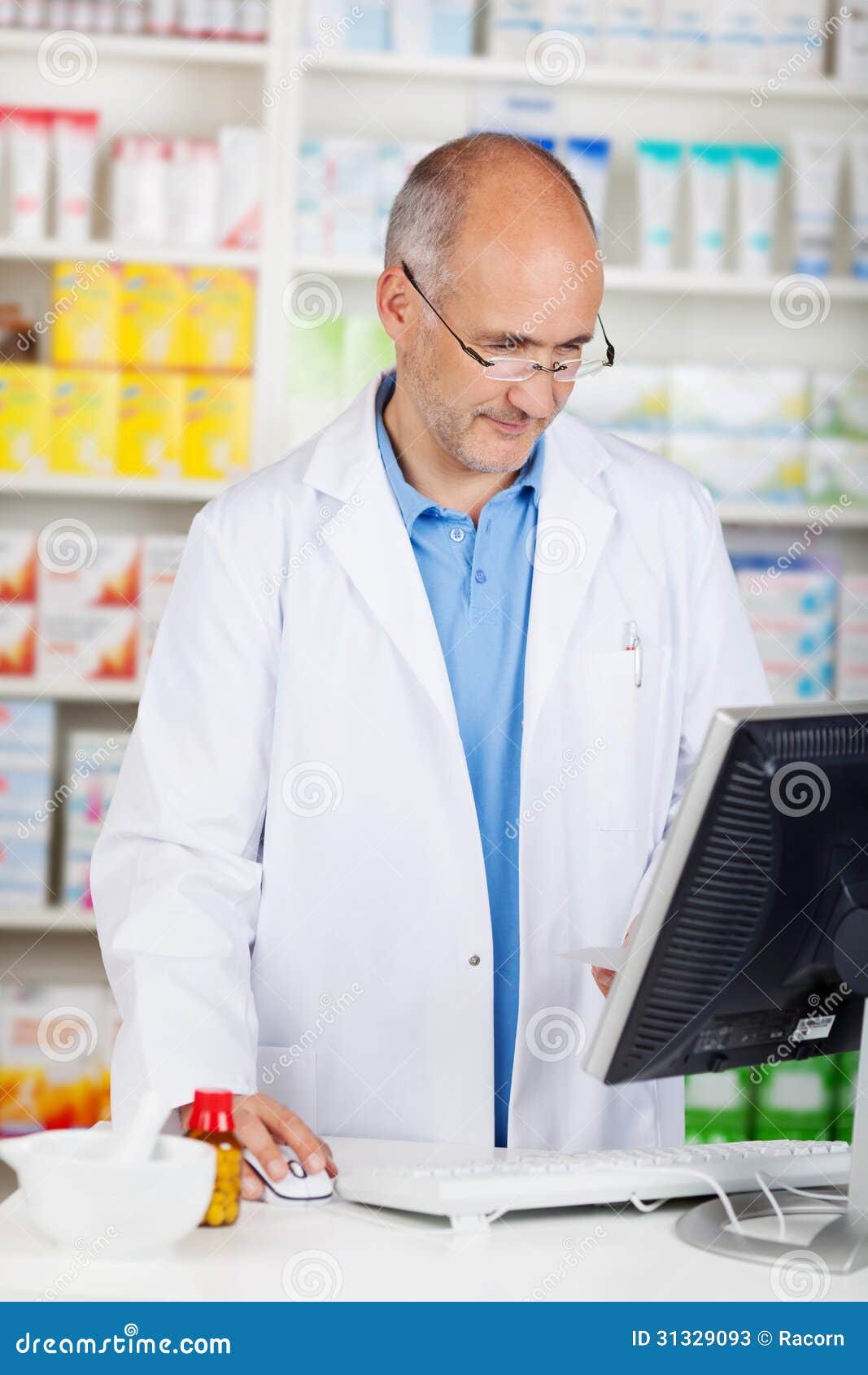 Pharmacist Looking at Computer Stock Image - Image of healthcare, focus ...