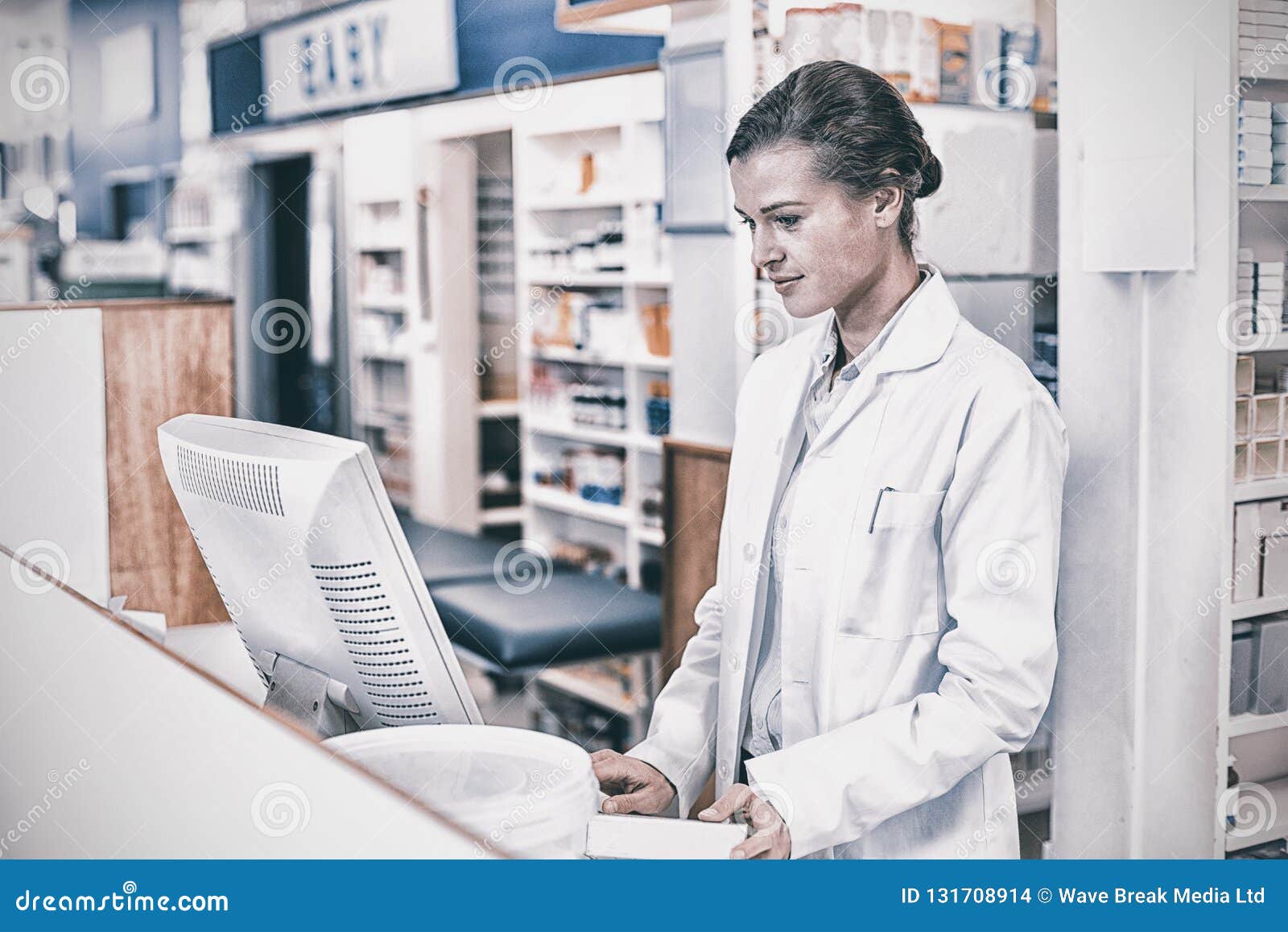 Pharmacist Making Prescription Record through Computer Stock Photo ...