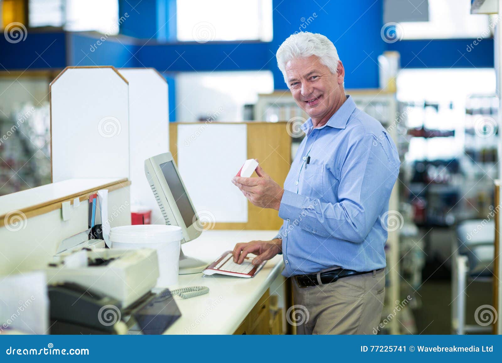 Pharmacist Making Prescription Record through Computer in Pharmacy ...