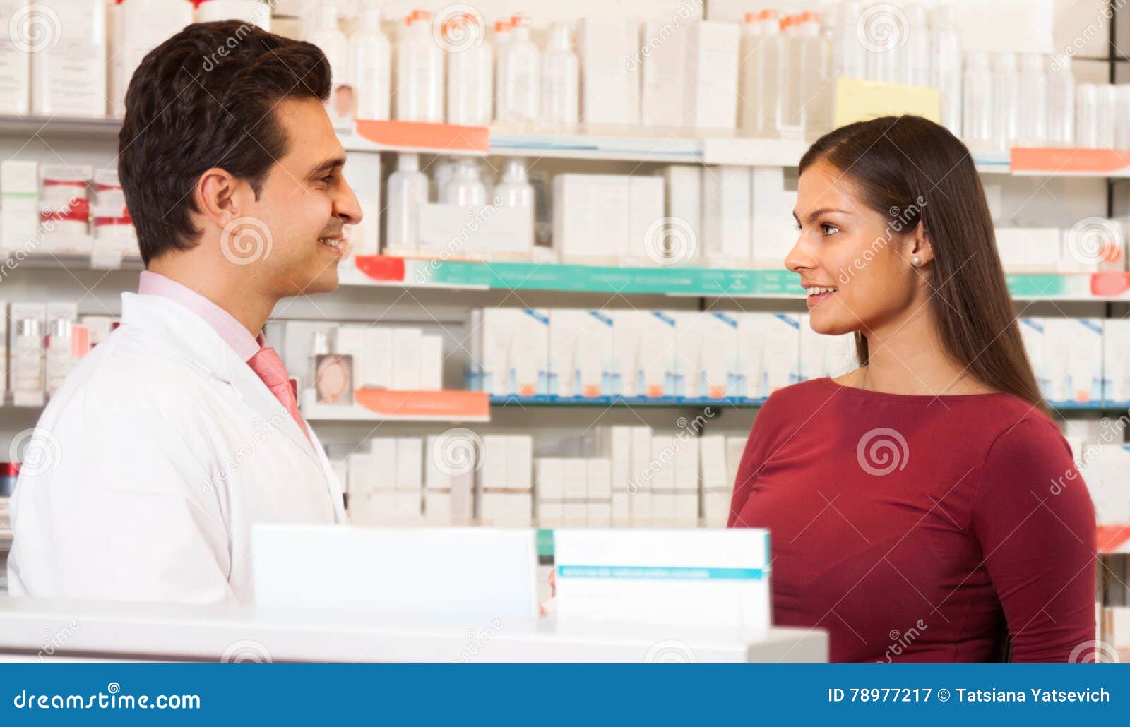 Pharmacist Man in the Pharmacy Communicates with the Visitor Stock ...
