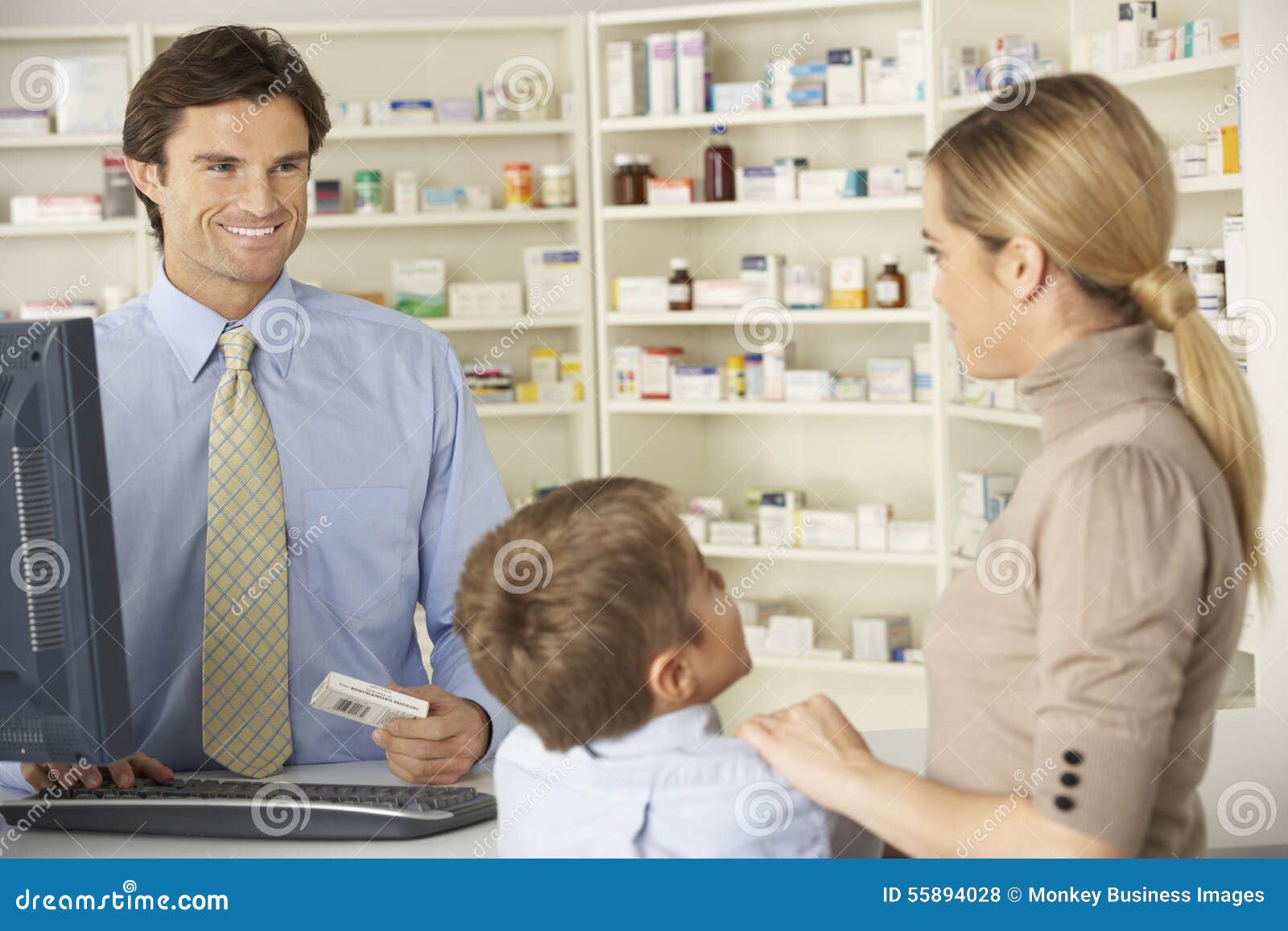 Pharmacist in Pharmacy with Mother and Child Stock Photo - Image of ...