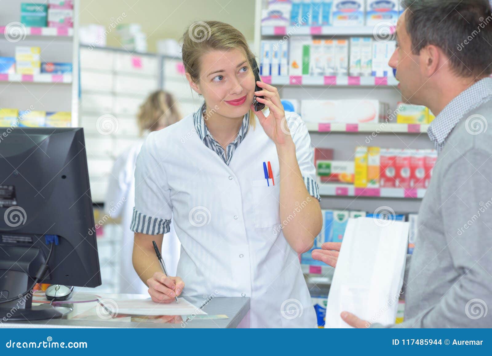 Pharmacist on the phone stock photo. Image of retail - 117485944