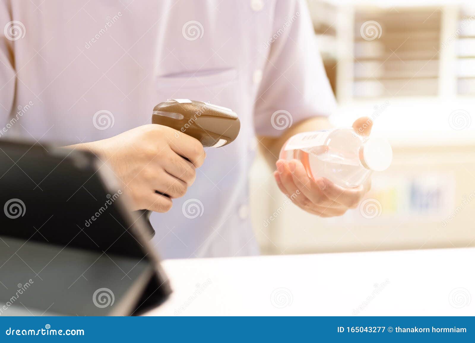 Pharmacist Scanning Barcode of Drug in a Pharmacy Stock Image - Image ...