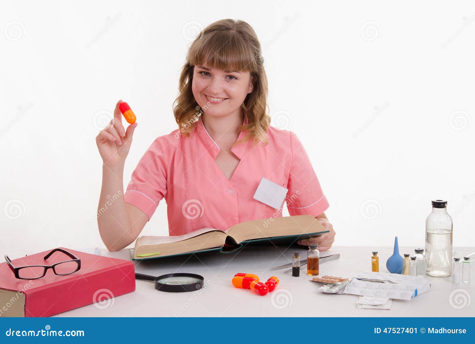 Pharmacist Sitting at Table with the Pill and Reference Stock Image ...
