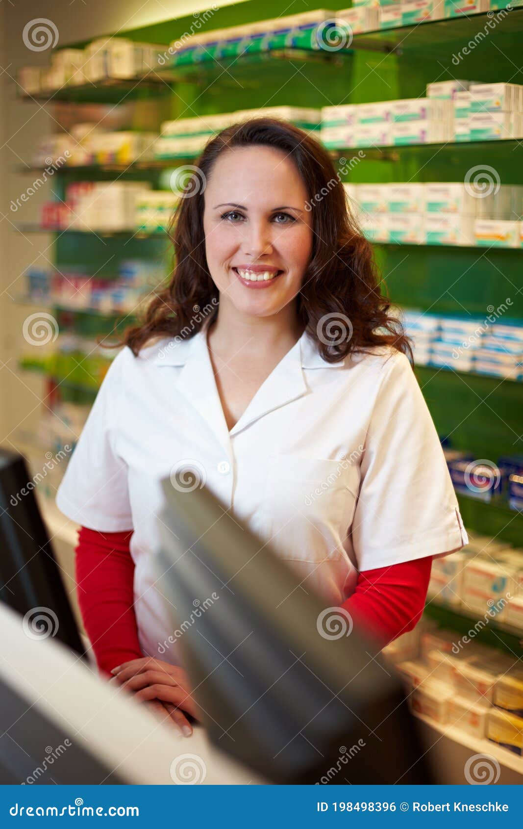 Pharmacist at checkout stock photo. Image of drugs, counter - 198498396