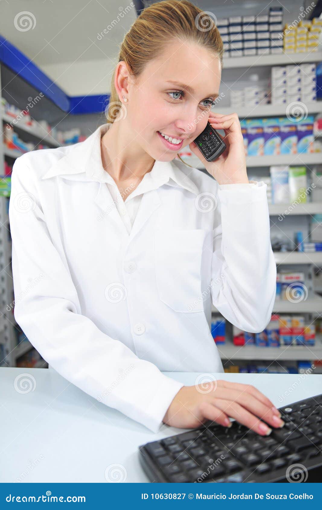 Pharmacist using computer stock image. Image of blond - 10630827