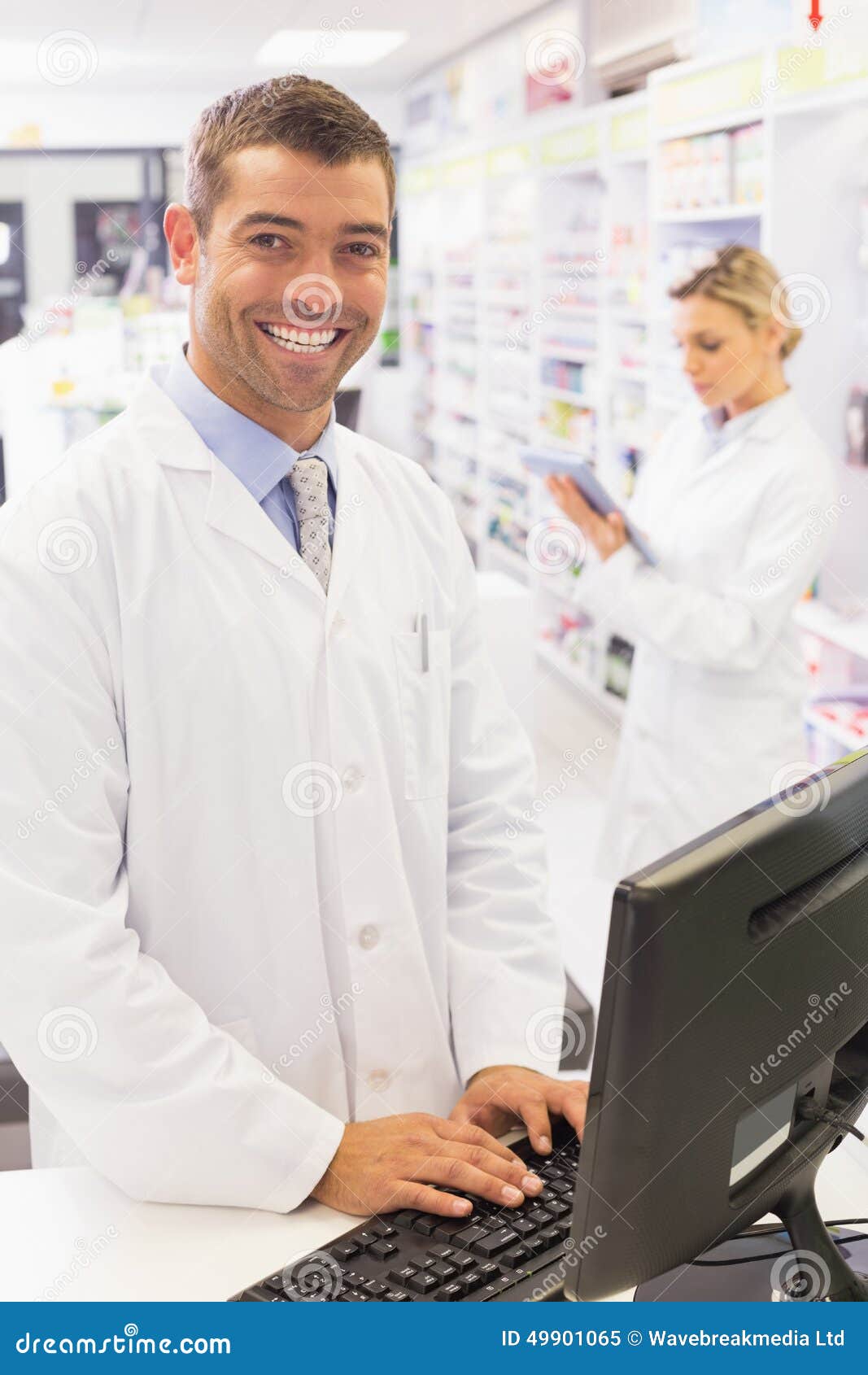 Pharmacist Using the Computer Stock Image - Image of people, happy ...