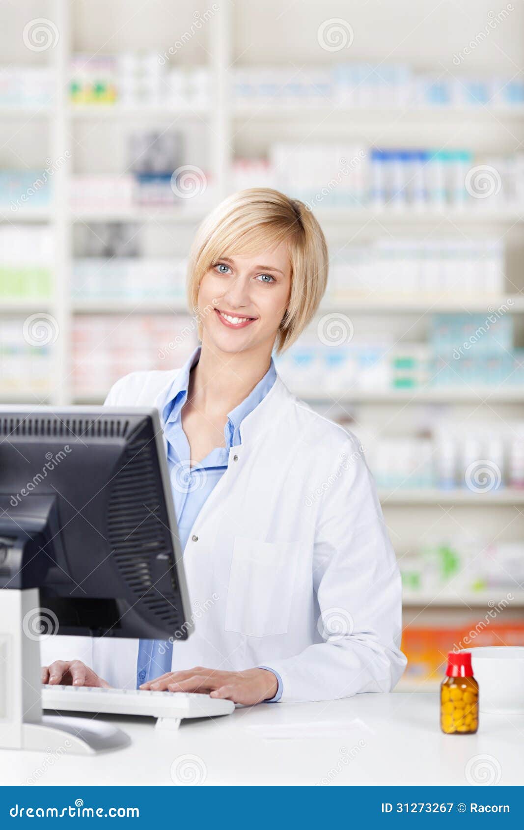 Pharmacist Using Computer at Pharmacy Counter Stock Image - Image of ...