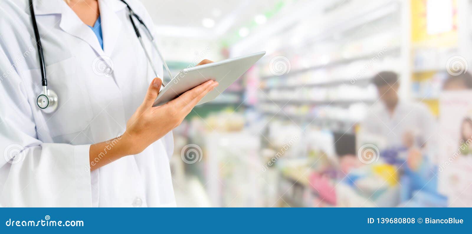 Pharmacist Using Tablet Computer at Pharmacy Stock Photo - Image of ...