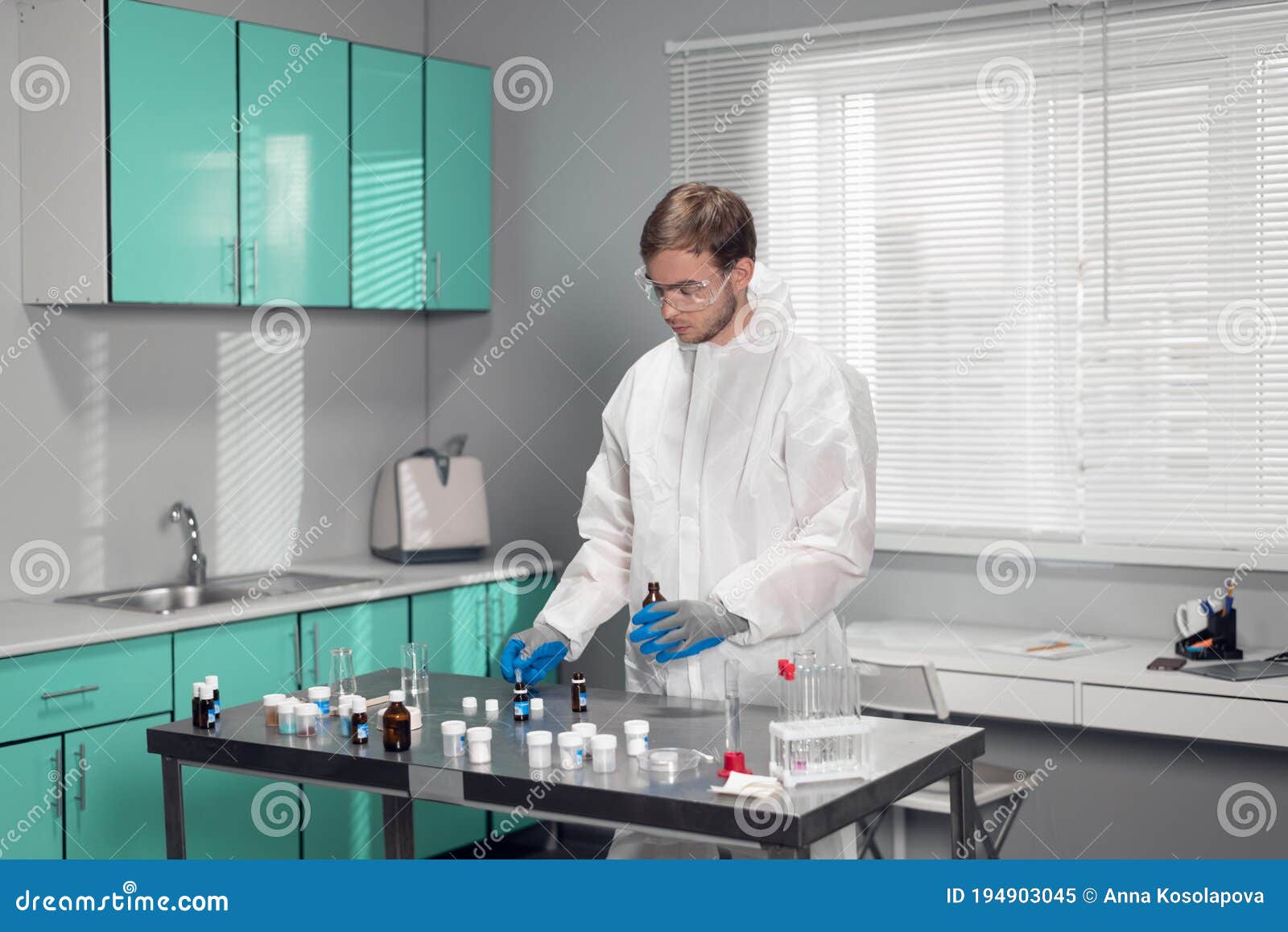 Pharmacist at Work. Testing Some Chemicals in Tubes at the Chemical ...