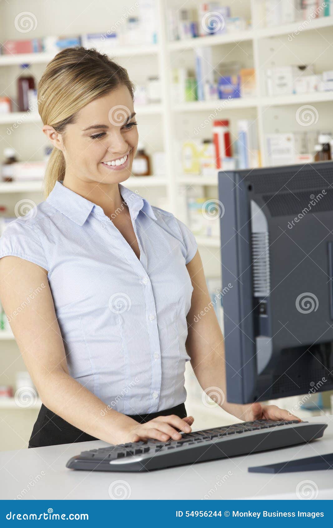 Pharmacist Working on Computer in Pharmacy Stock Photo - Image of ...