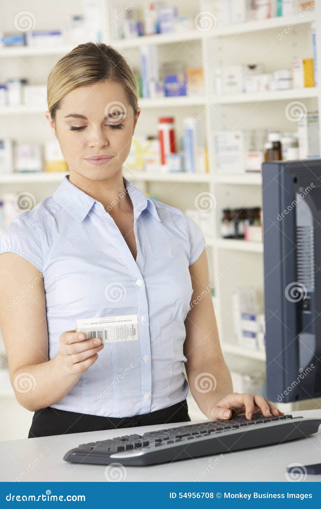 Pharmacist Working on Computer in Pharmacy Stock Photo - Image of ...