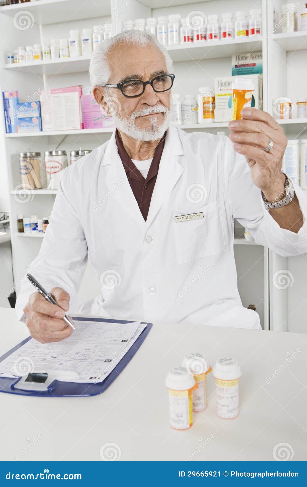 Pharmacist Working in Pharmacy Stock Image - Image of medical, bottle ...