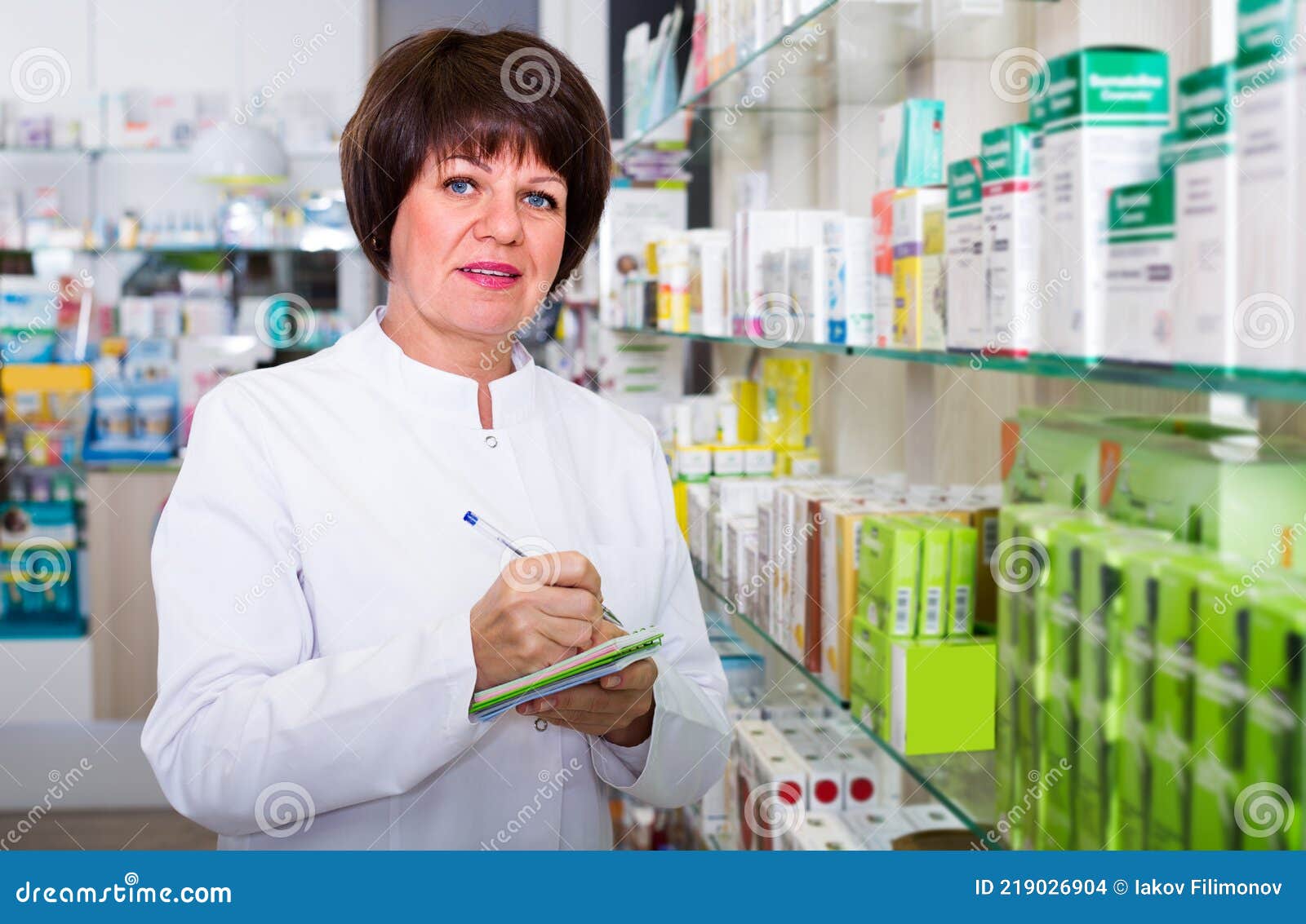 Pharmacist working in shop stock photo. Image of consulting - 219026904