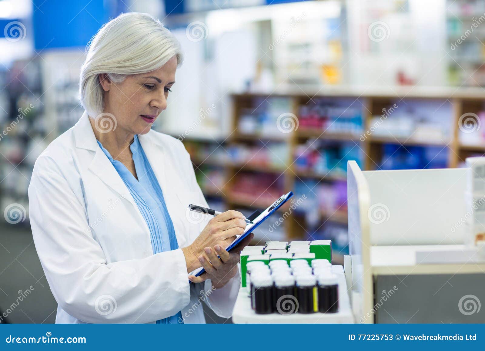 Pharmacist Writing on Clipboard Stock Image - Image of focused ...