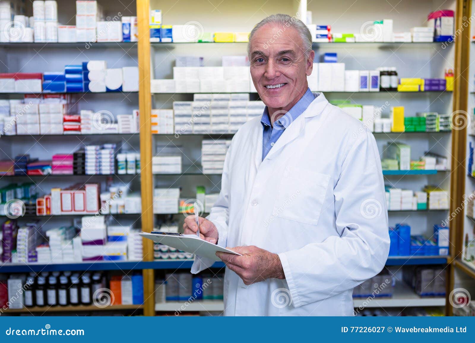 Pharmacist Writing on Clipboard in Pharmacy Stock Image - Image of ...