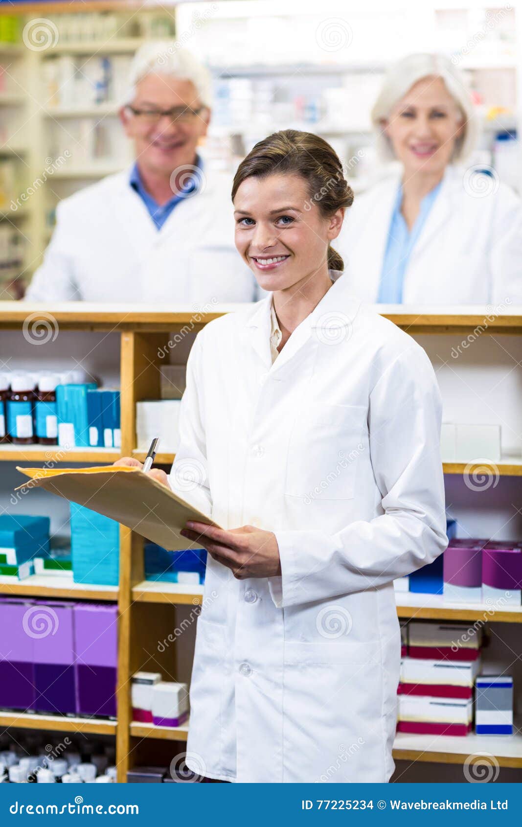 Pharmacist Writing on File in Pharmacy Stock Photo - Image of male ...
