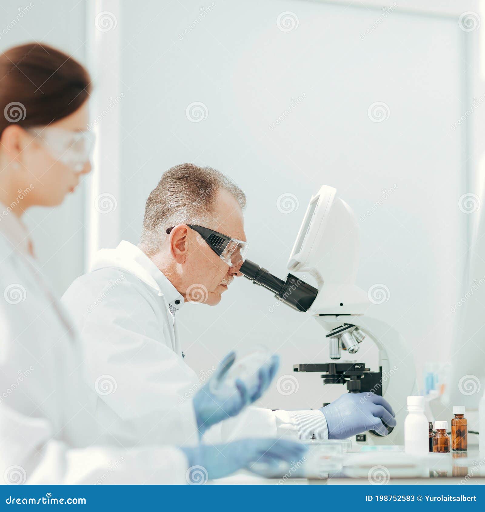 Pharmacists from All Over Using Microscope in the Laboratory. Stock ...