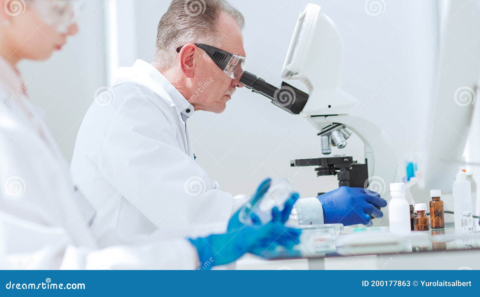 Pharmacists from All Over Using Microscope in the Laboratory. Stock ...