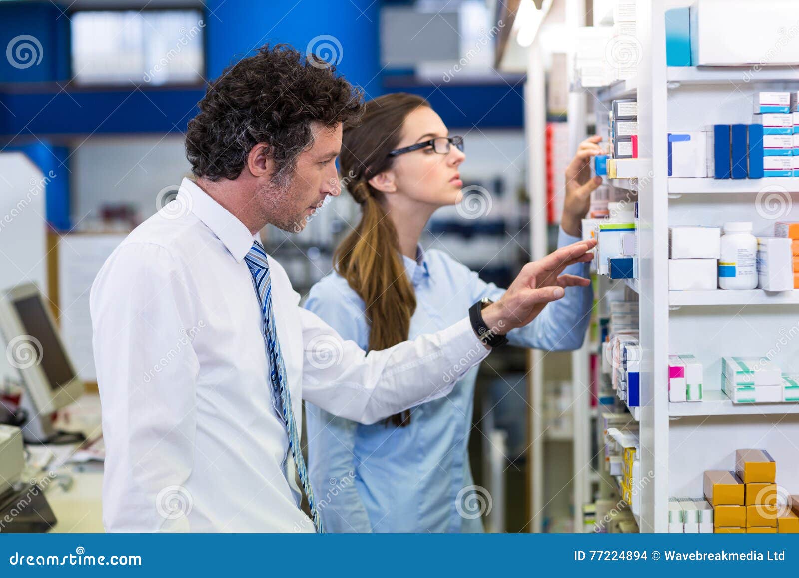 Pharmacists Checking Medicines on Shelf in Pharmacy Stock Photo - Image ...